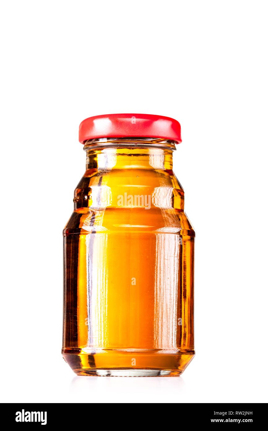 small glass bottle full with liquid isolated on white Stock Photo - Alamy