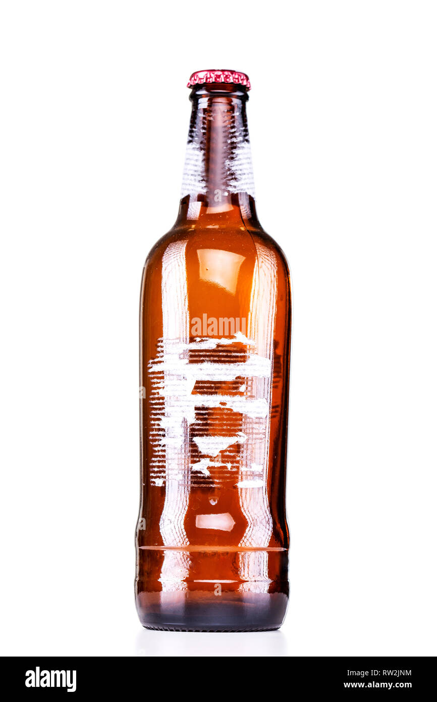 beer bottle with torn label isolated on white Stock Photo - Alamy