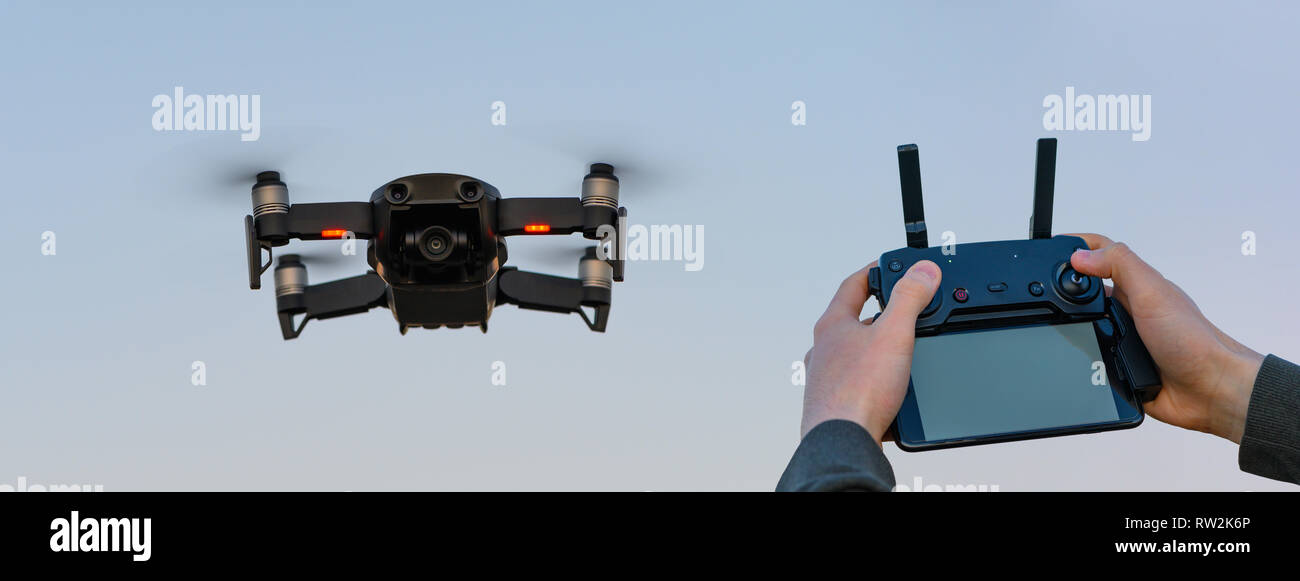 Drone in the sky with remote controller Stock Photo - Alamy