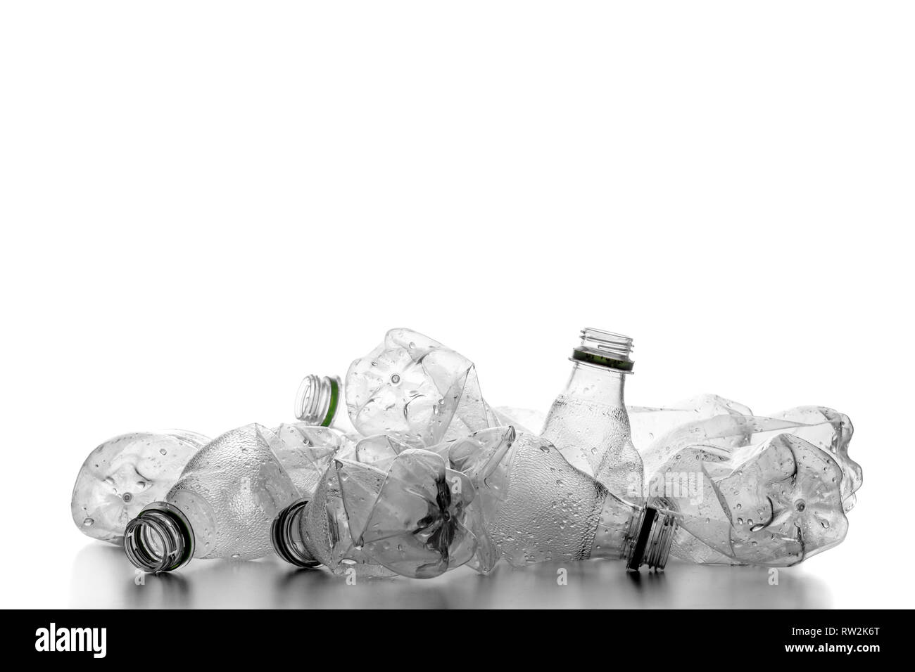 group of smashed empty plastic bottles, isolated on white background ...