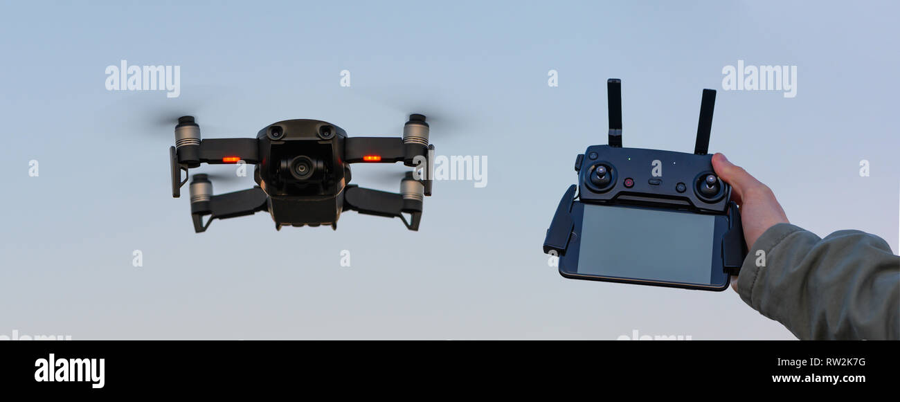 Drone in the air with operator Stock Photo - Alamy