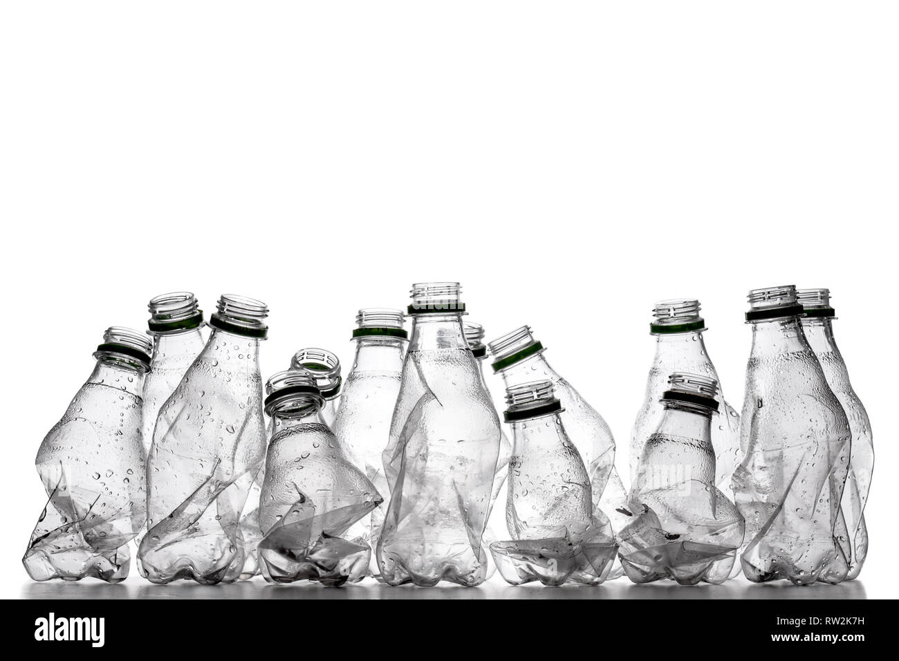 group of smashed empty plastic bottles, isolated on white background ...