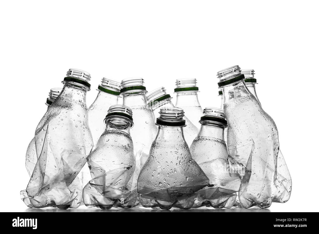 group of smashed empty plastic bottles, isolated on white background ...