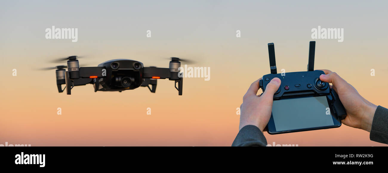 Drone in the sky with remote controller Stock Photo - Alamy