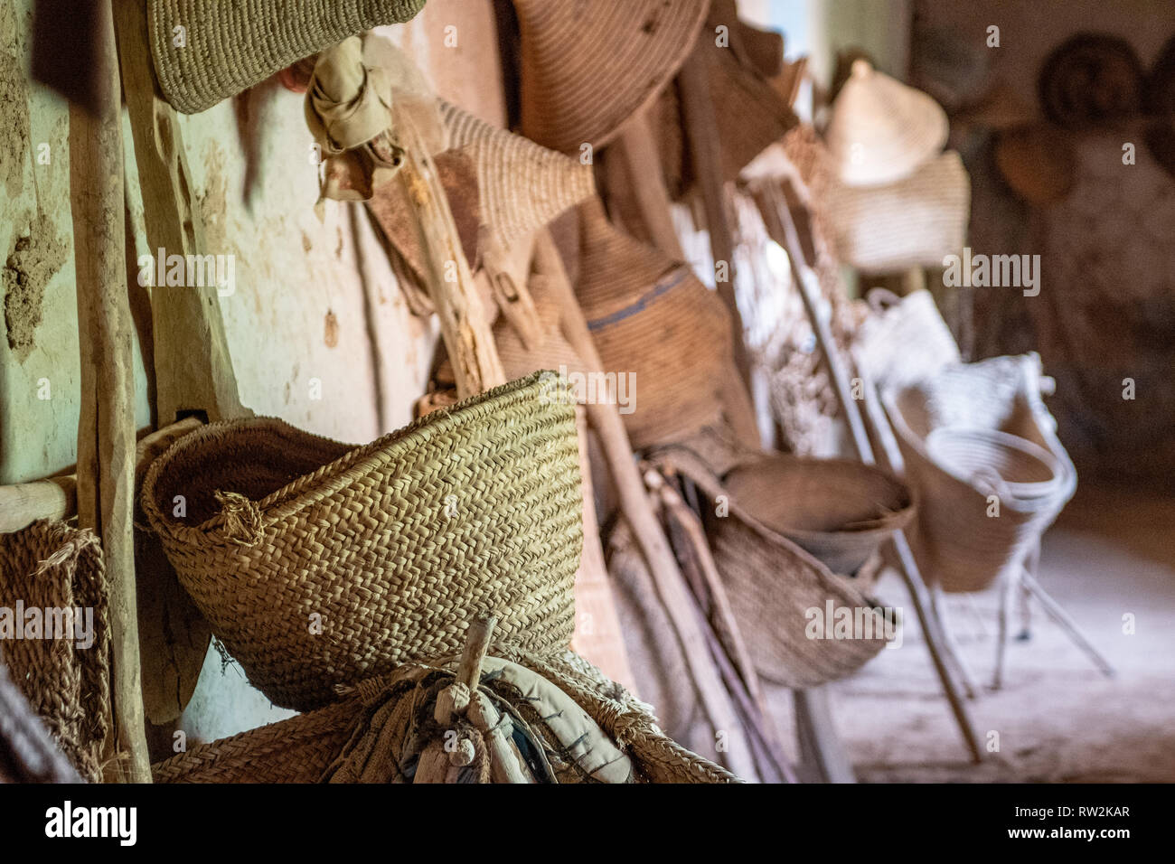 Detail view of woven baskets and traditional farming equipment used by ...
