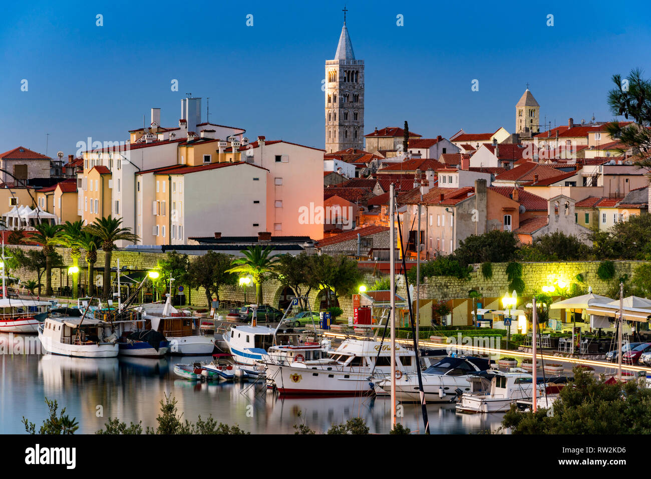 Rab, Croatia - August 26, 2017: Marina in the city of Rab with the city ...
