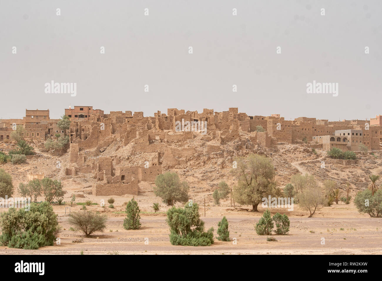 The crumbling remains of mud brick structures in the desert near Akka N ...
