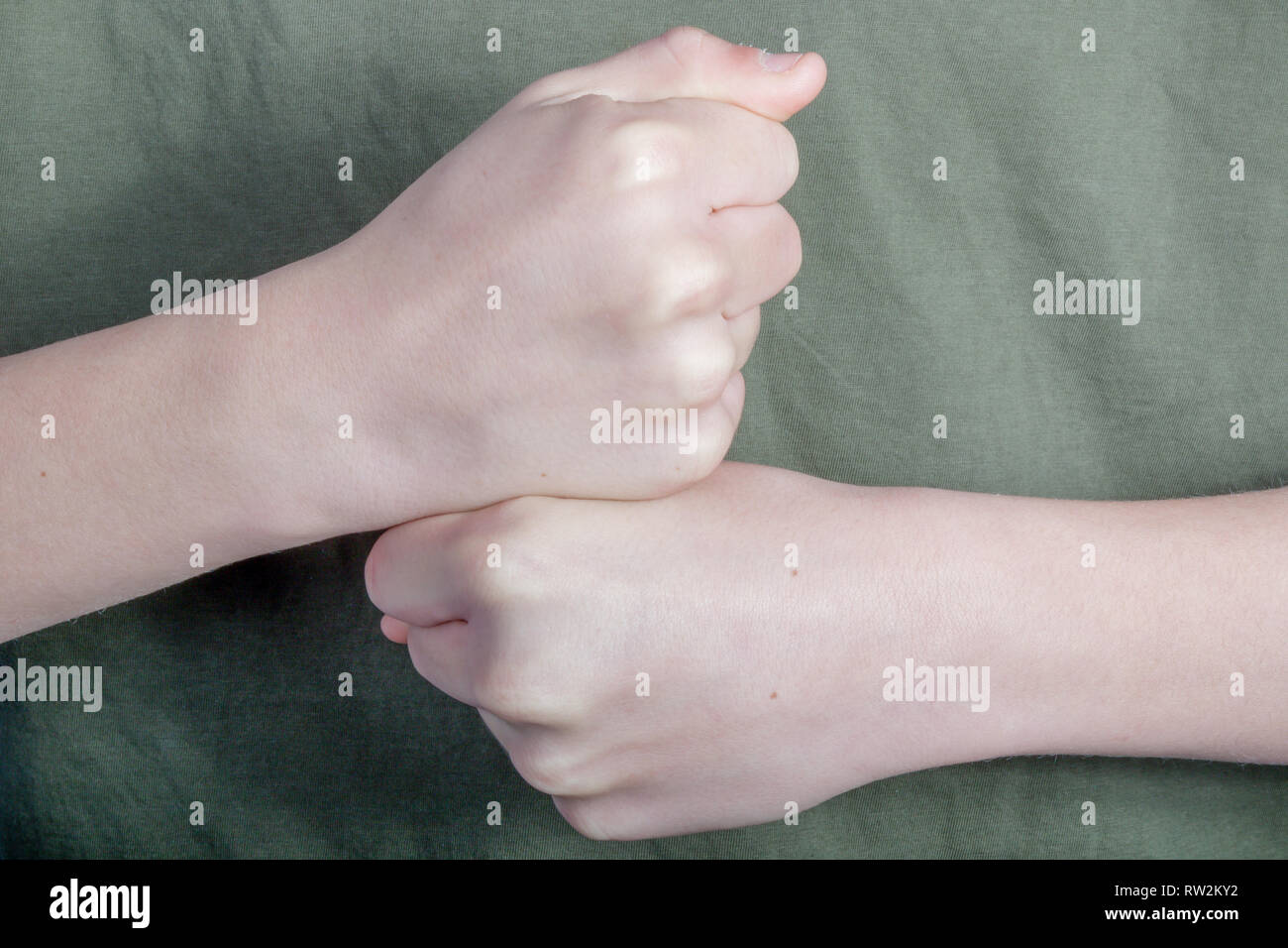 Caucasian hand doing British Sign Language showing the symbol for G ...