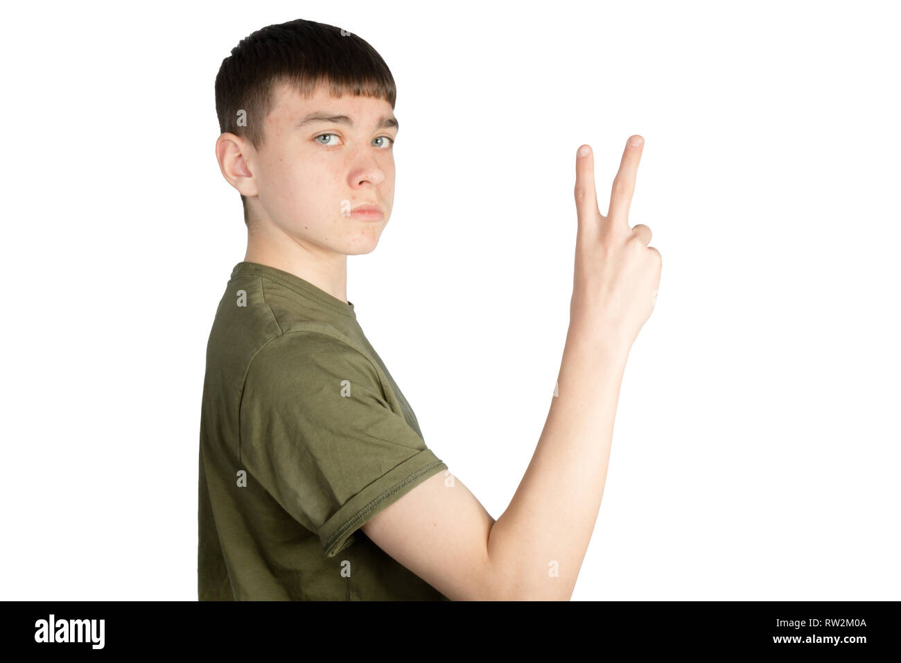 Caucasian teenage boy doing British Sign Language showing the symbol ...