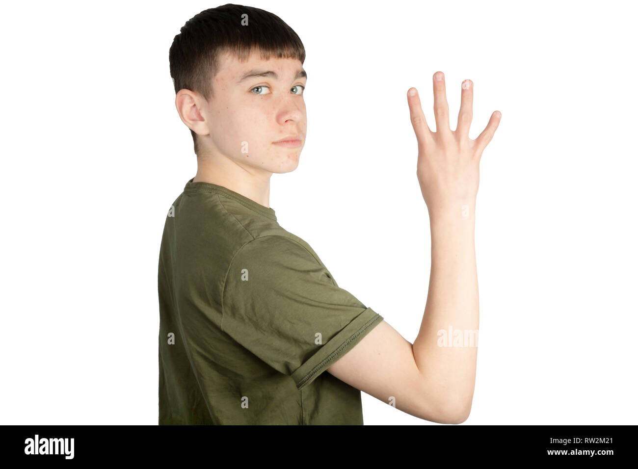 Caucasian teenage boy doing British Sign Language showing the symbol ...