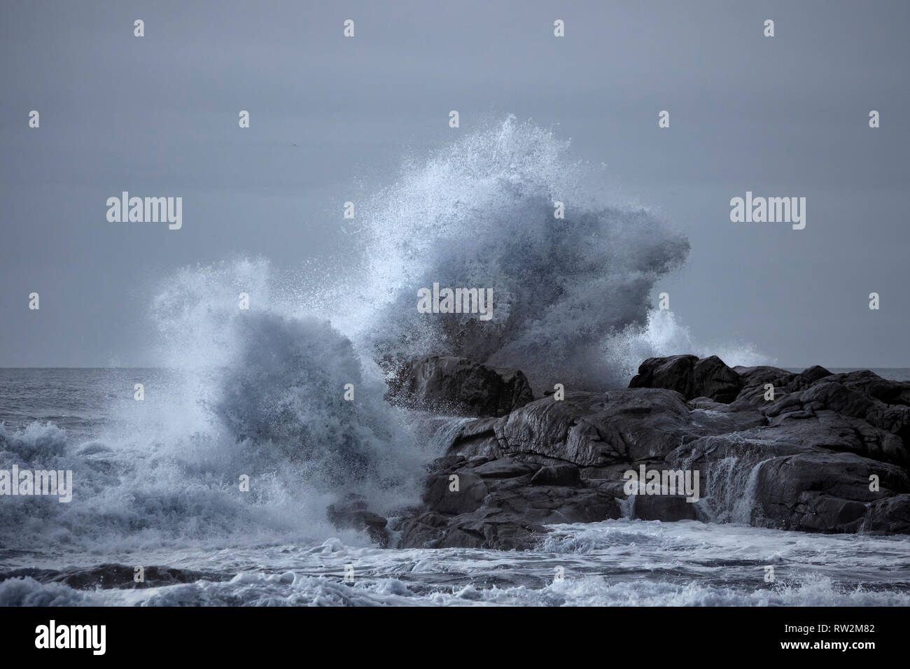 Big wave splash against rocks from a seaside in the north of Portugal ...