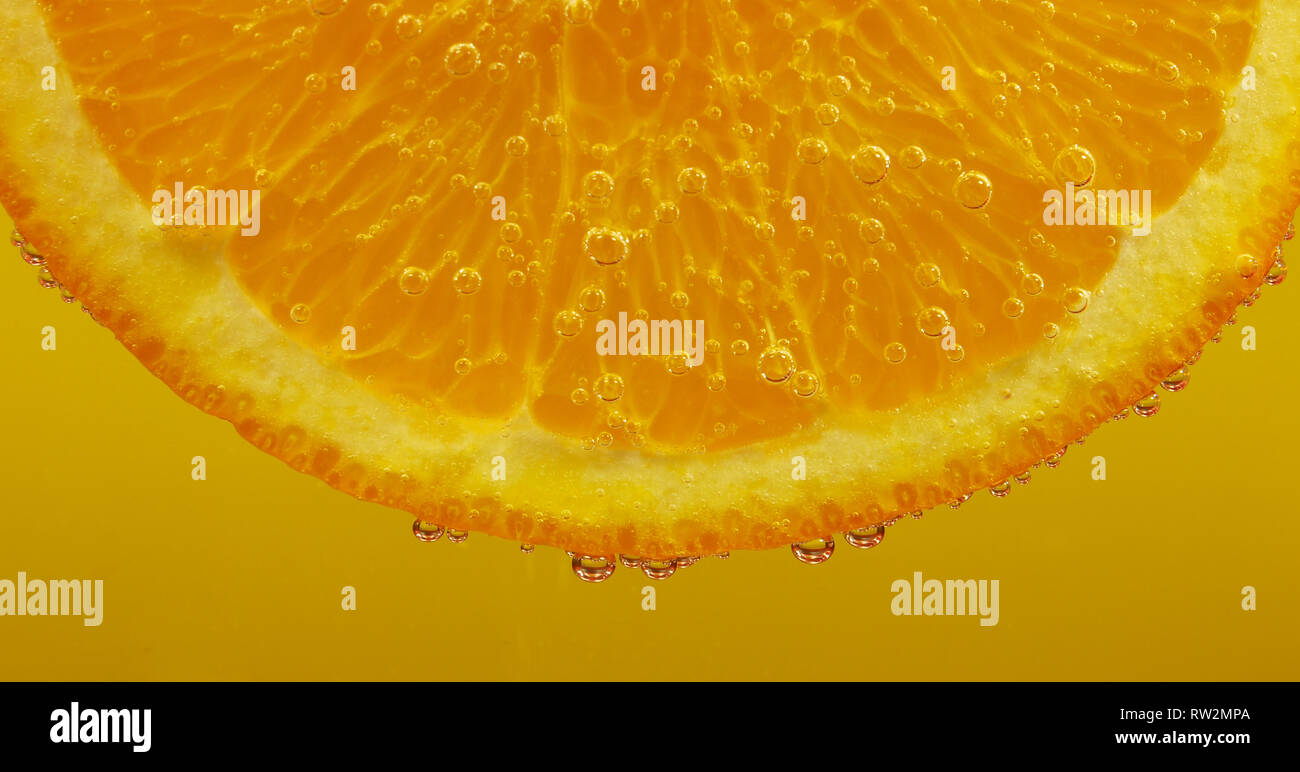 Fresh slice of orange with bubbles Stock Photo - Alamy