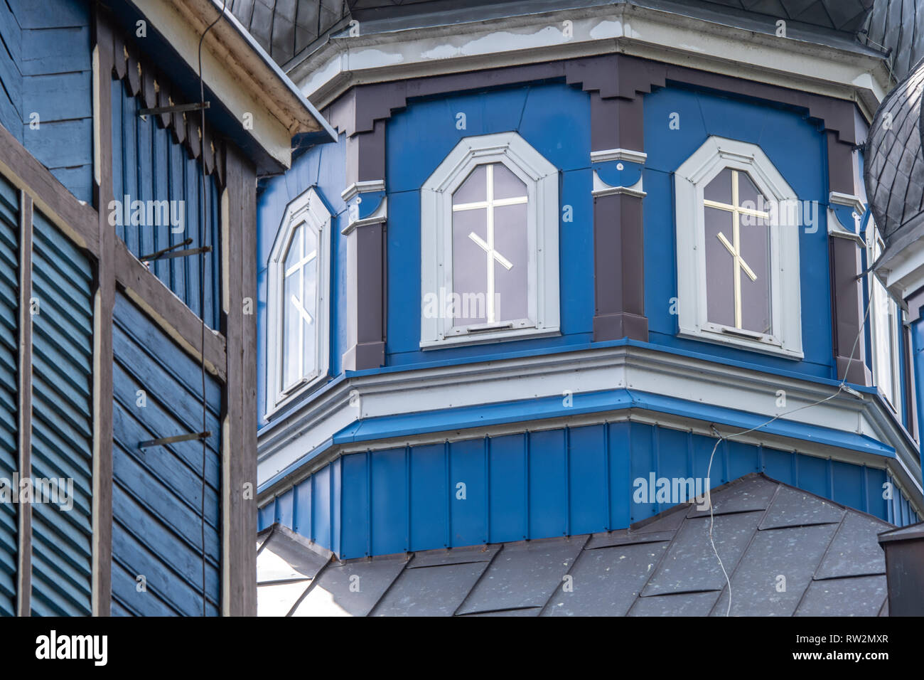 Windows wrap around steeple of blue Russian Orthodox Church (Parafia ...