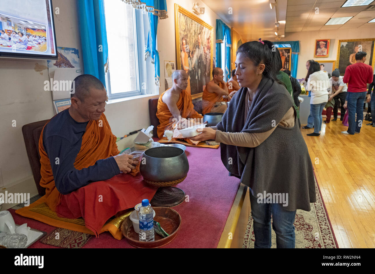 Devout Buddhist worshippers participate in the ancient ritual of ...