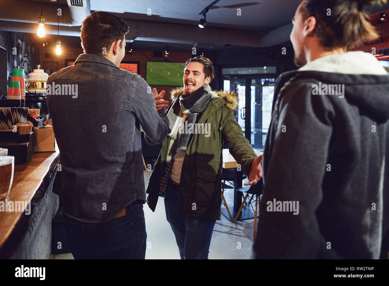Meeting friends at the bar Stock Photo - Alamy