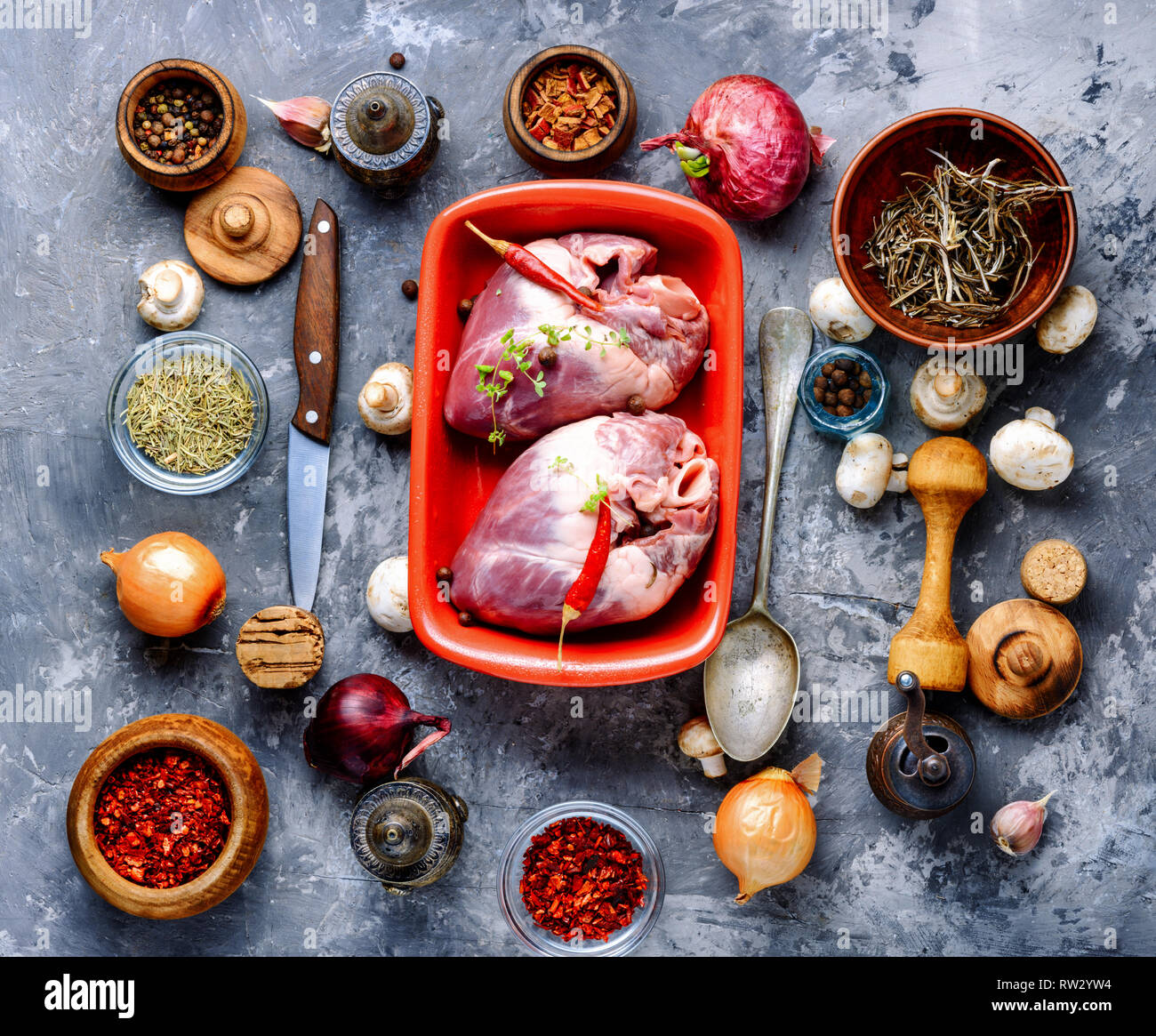 Raw pig heart with spices before cooking. Raw meat Stock Photo - Alamy