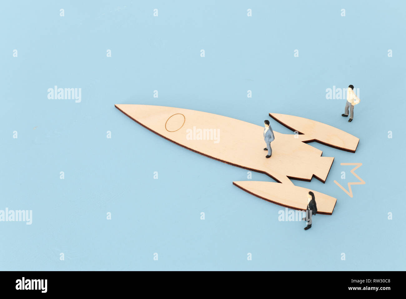 leadership and teamwork concept miniature people and rocket ...