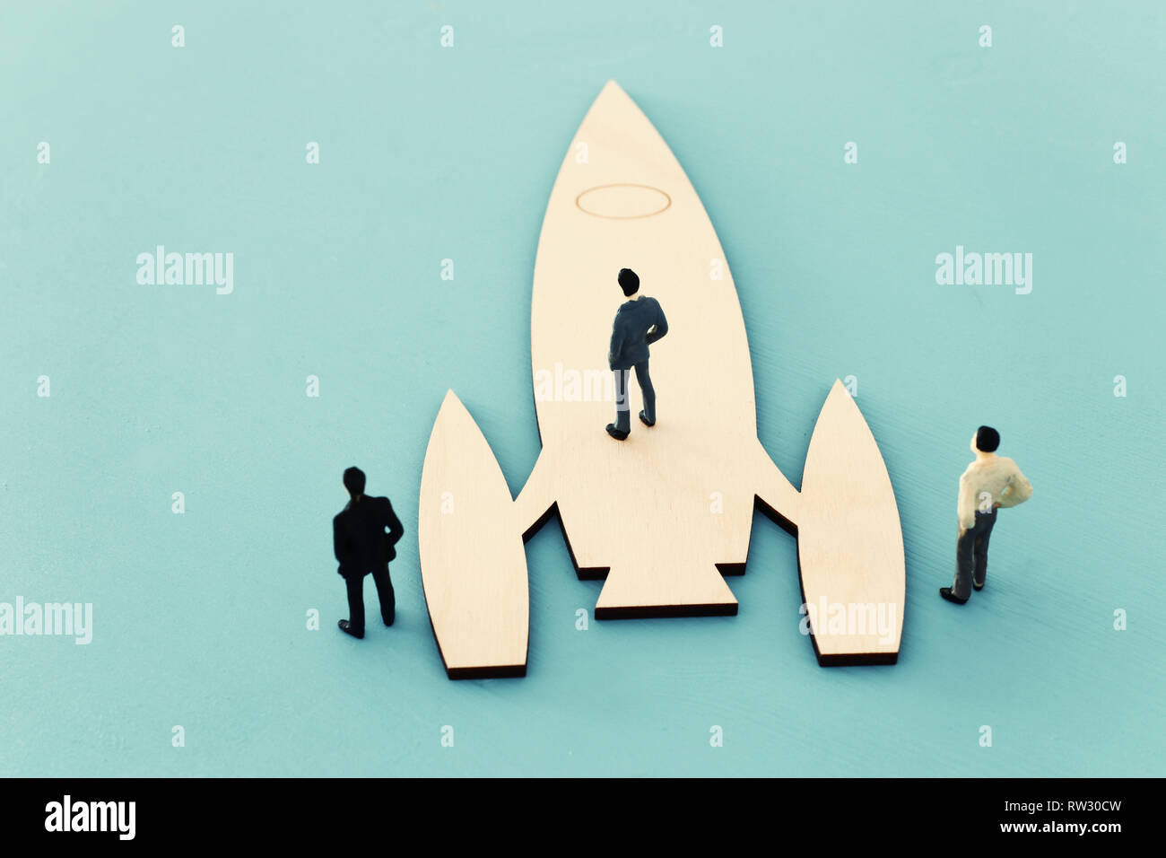 leadership and teamwork concept miniature people and rocket ...