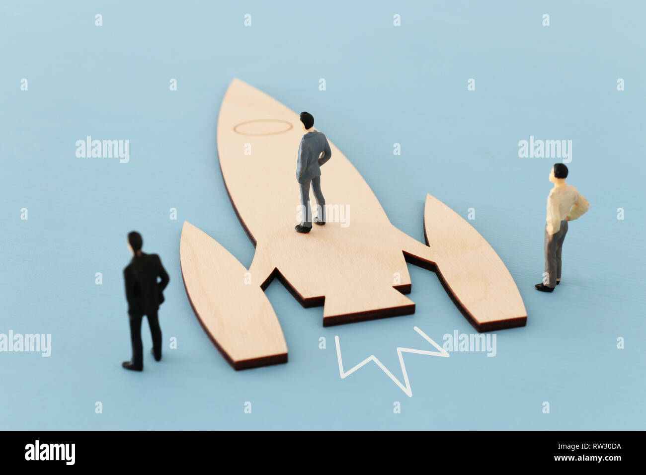 leadership and teamwork concept miniature people and rocket ...
