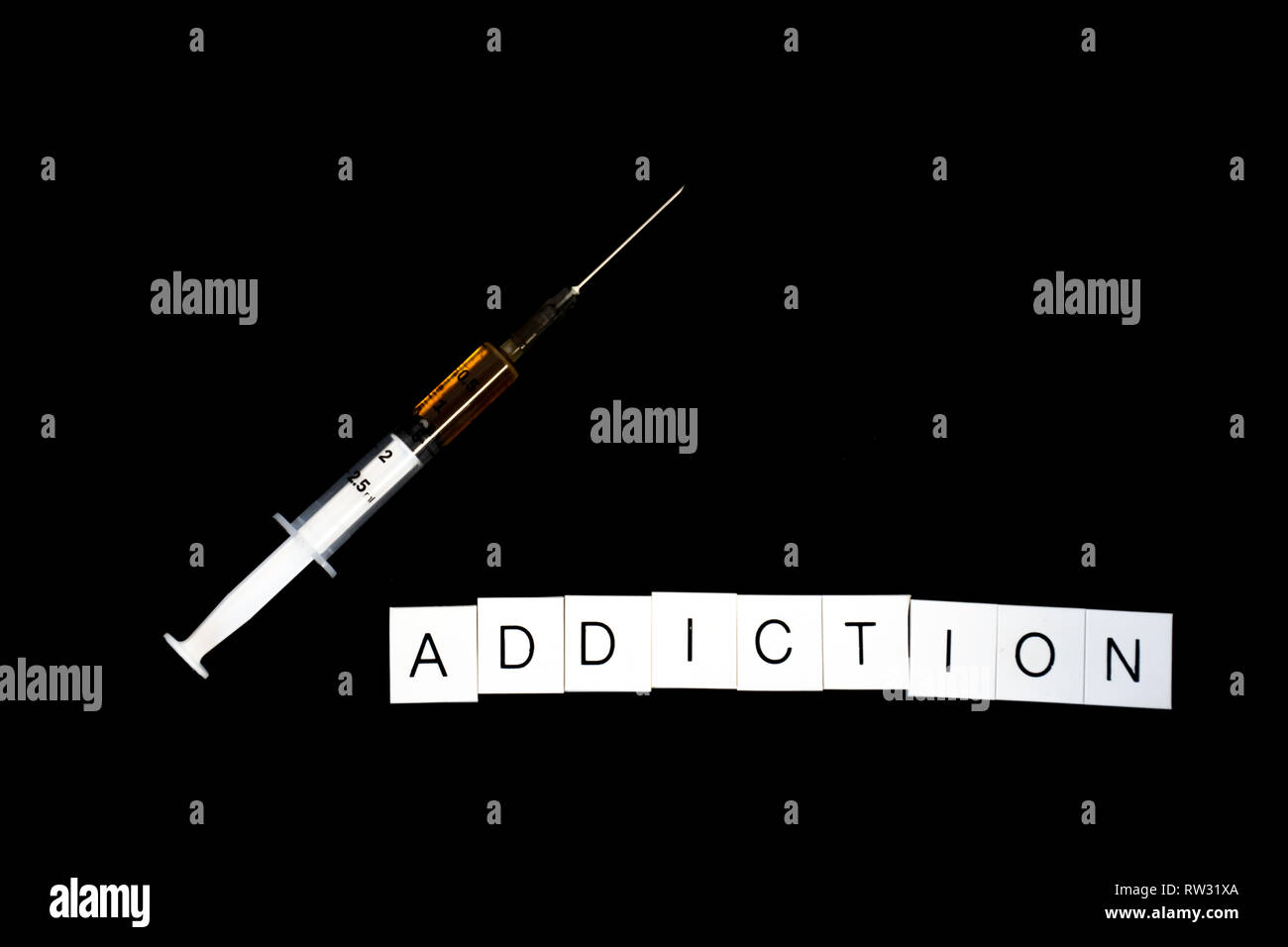 Word addiction in uppercase letters with syringe full of drug on black ...