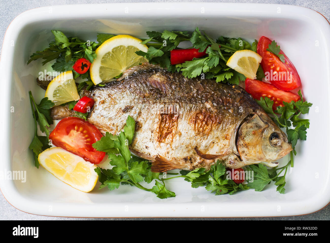 Tray baked fish potatoes hi-res stock photography and images - Alamy