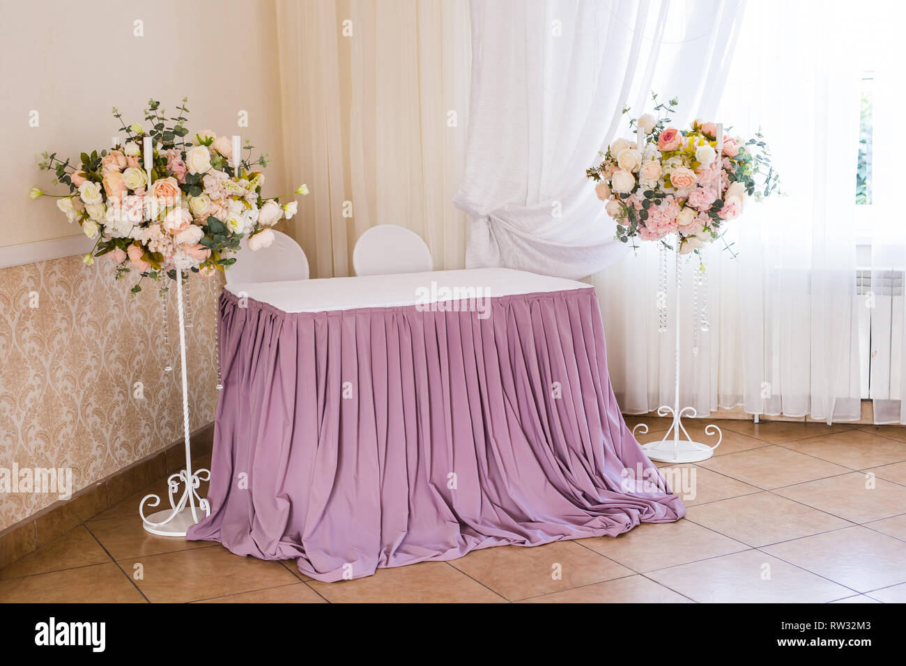 Banquet room with dining tables for guests during the wedding ceremony ...