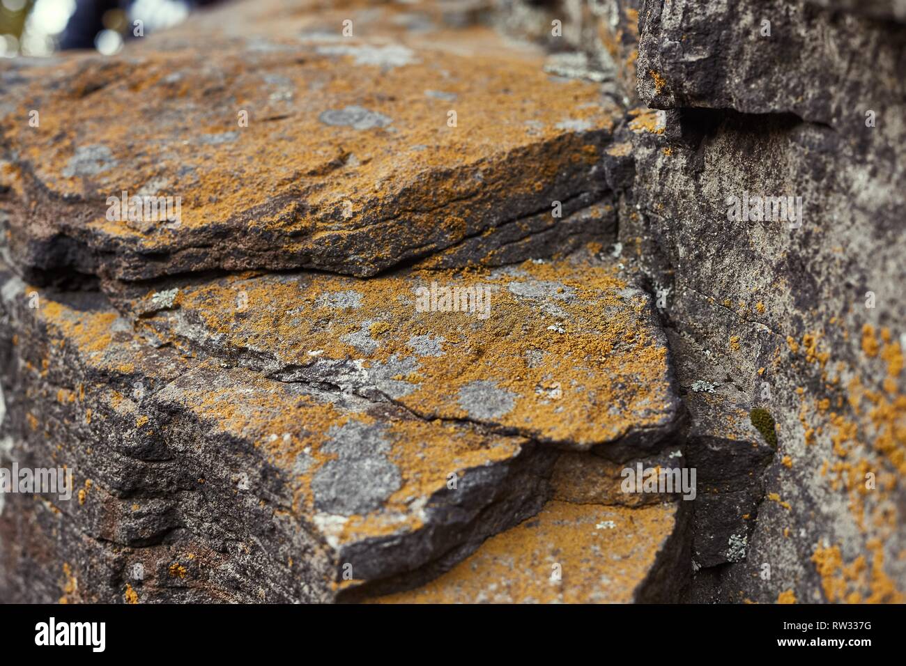 Dark rock boulder Stock Photo - Alamy