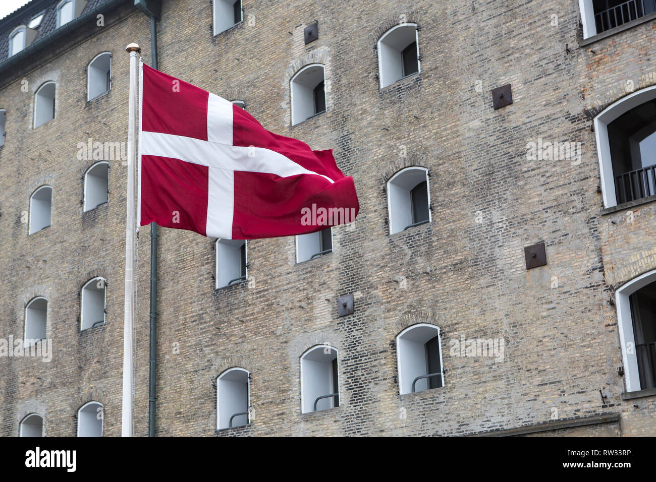 Danish flag waving in the wind outdoors Stock Photo - Alamy