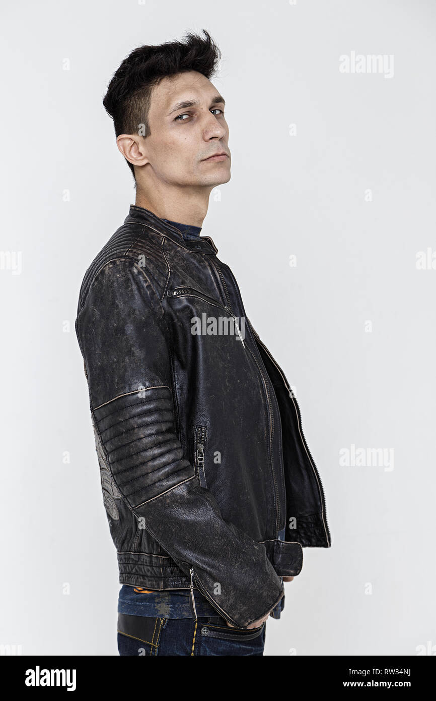 Haughty man in leather jacket on white background, photo in studio ...