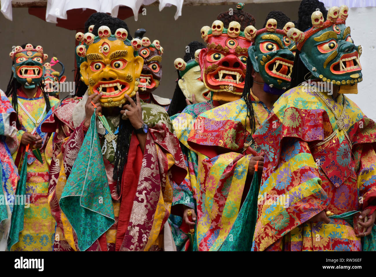 Buddhist monks in masks for the performance of the Dance of Tsam in the ...