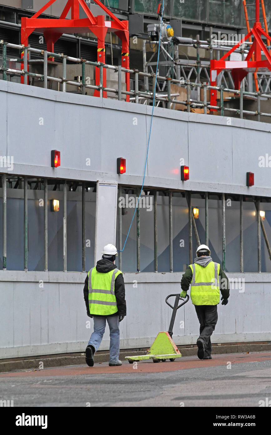 Two Builders Workers at Construction Site in London Stock Photo - Alamy