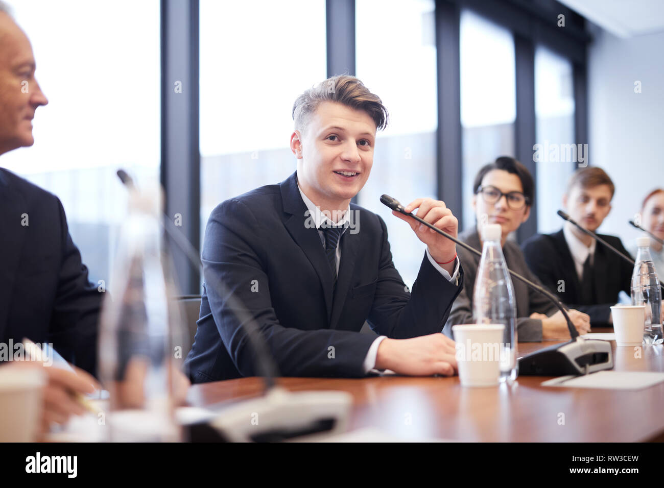 Businessman talking reporter speaking financial hi-res stock ...