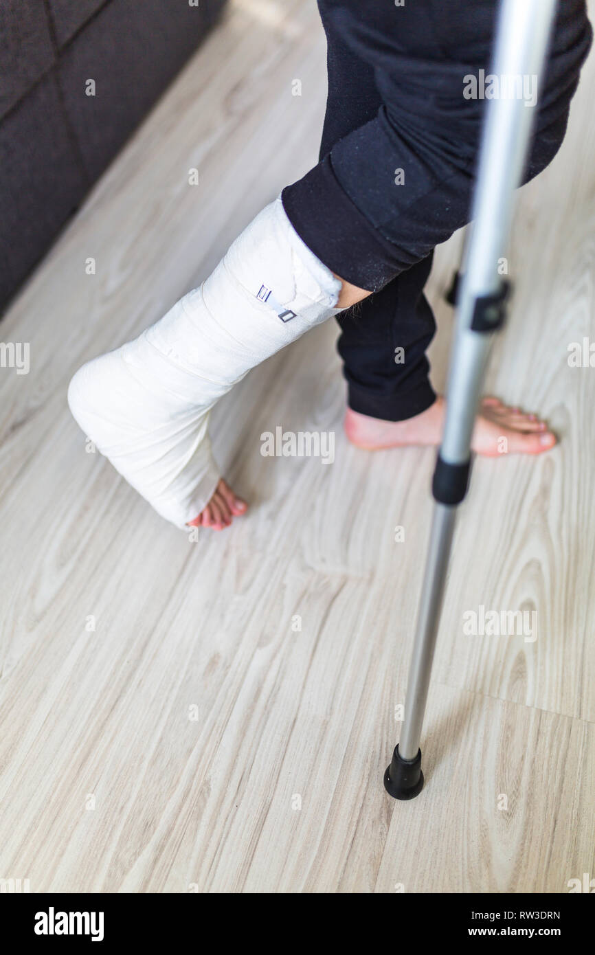 The man is trying to walk with a broken leg Stock Photo - Alamy