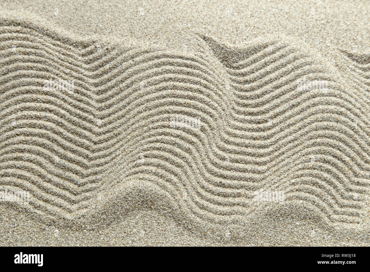 Sand texture with the wave pattern Stock Photo - Alamy