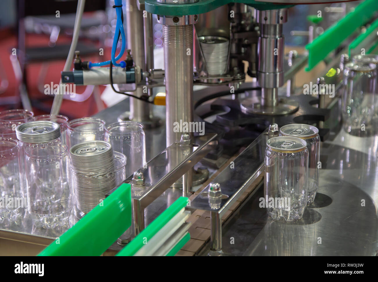 Production line of automatic ring pull can sealing machine Stock Photo ...