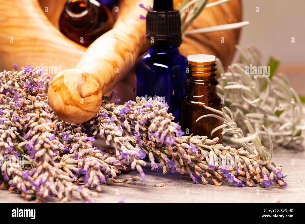 lavender mortar and pestle and bottles of essential oils for aromatherapy Stock Photo - Alamy