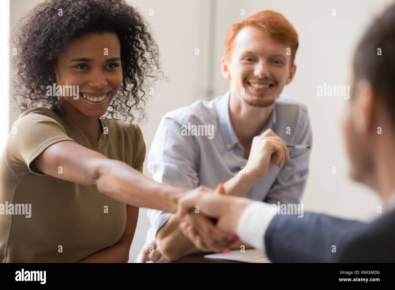 Happy african hr handshake candidate at team meeting job interview ...