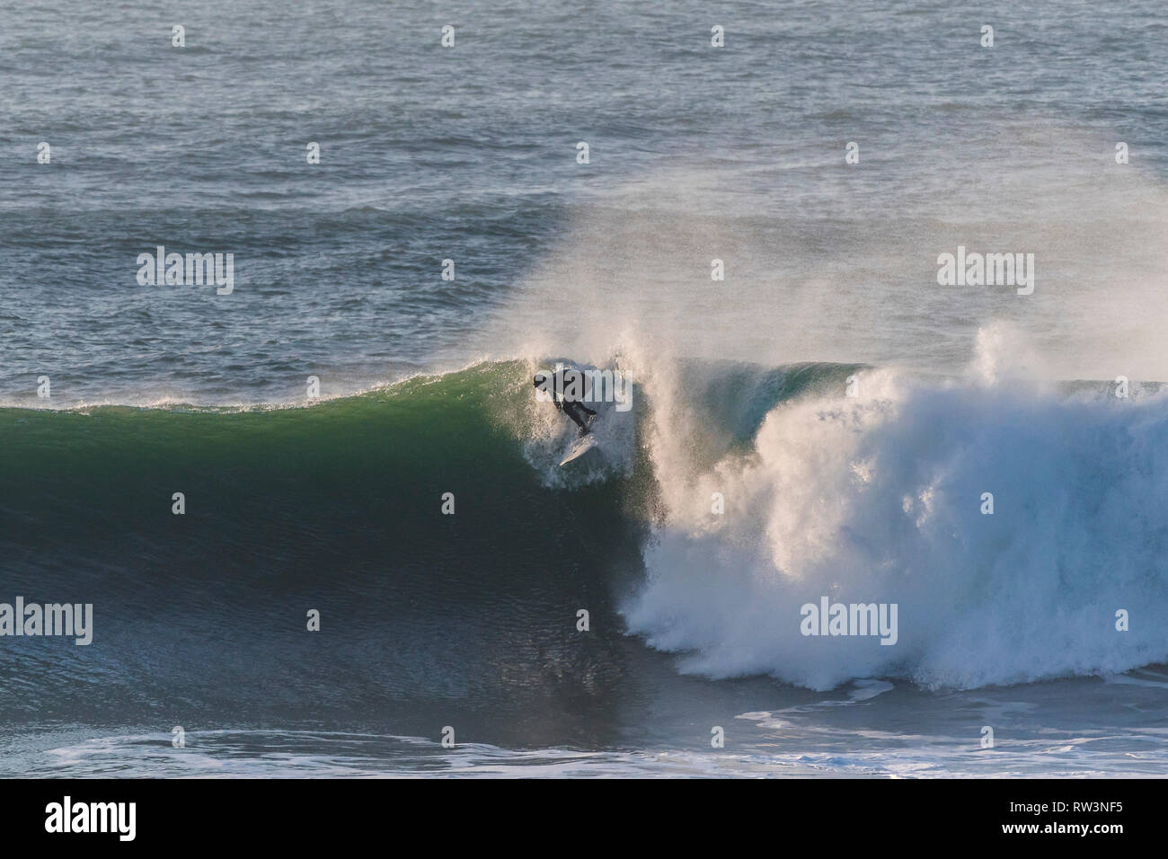 Big wave surfing action at Newquay Cornwall Stock Photo - Alamy