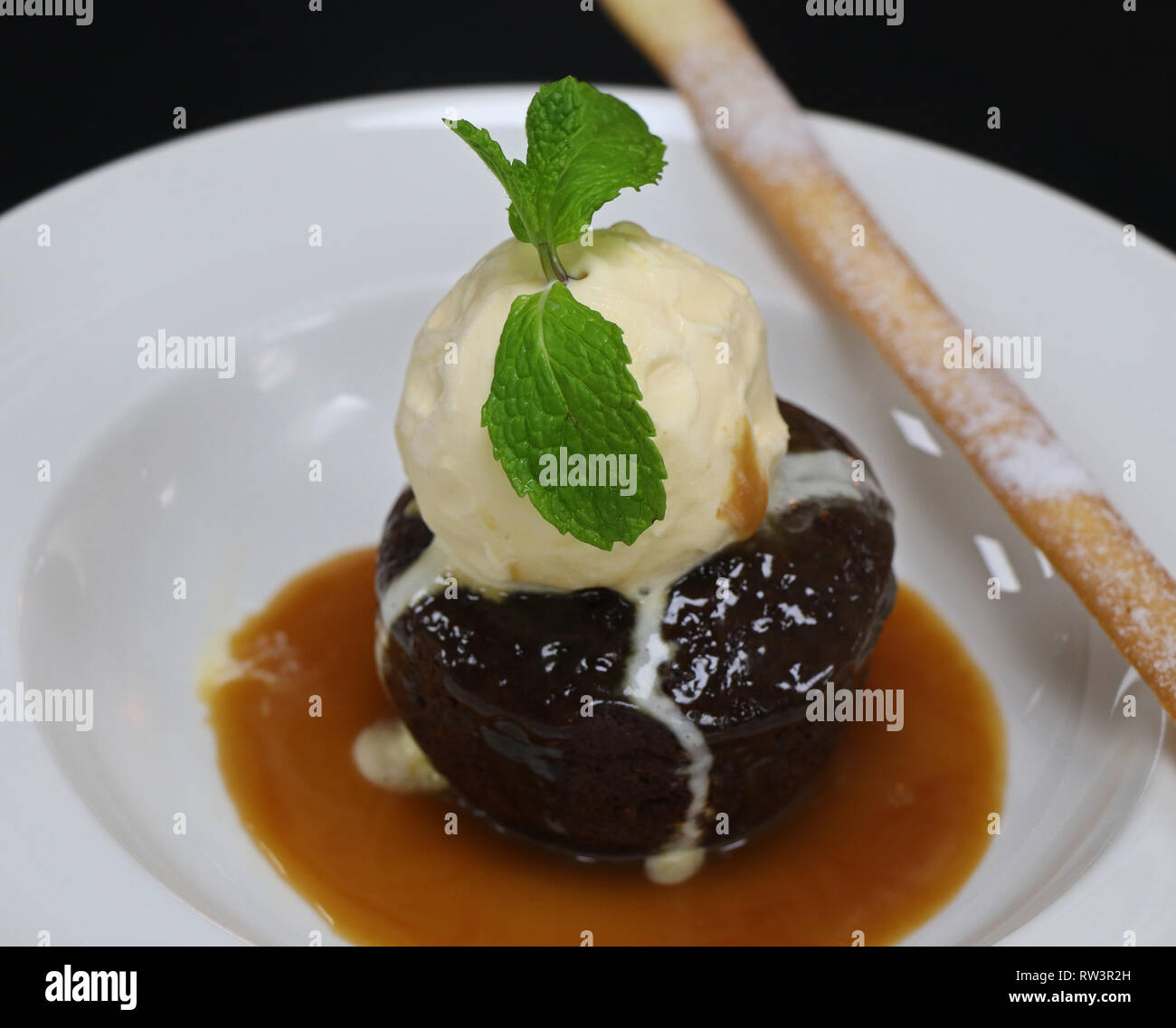 sticky toffee pudding with vanilla ice cream and caramel sauce Stock ...