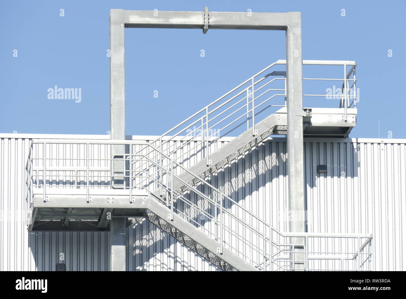 External staircase made of steel on a white factory building Stock ...