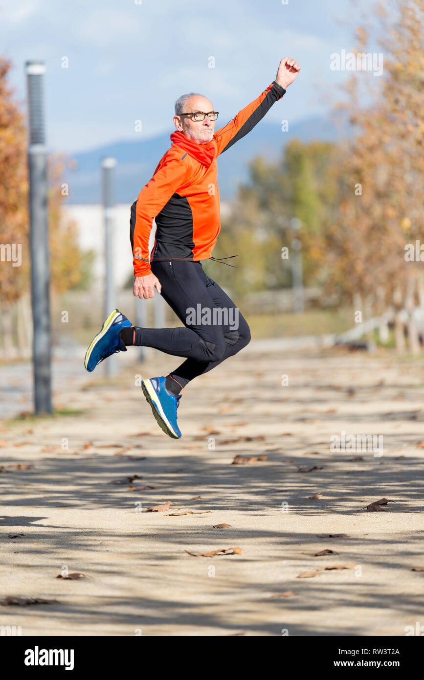 Runner arms up man hi-res stock photography and images - Alamy