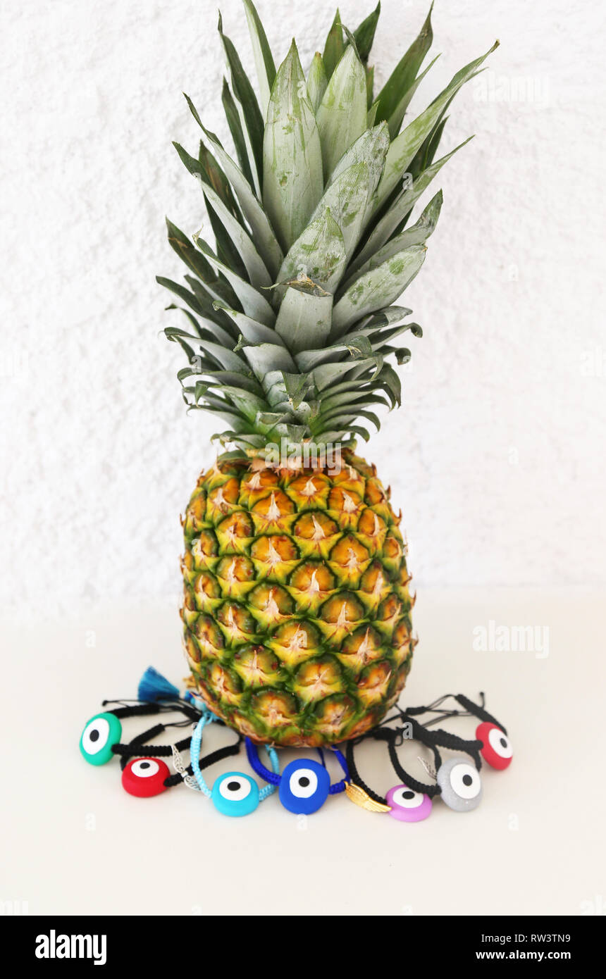 evil eye bracelets advertisement with exotic pineapple fruit Stock ...