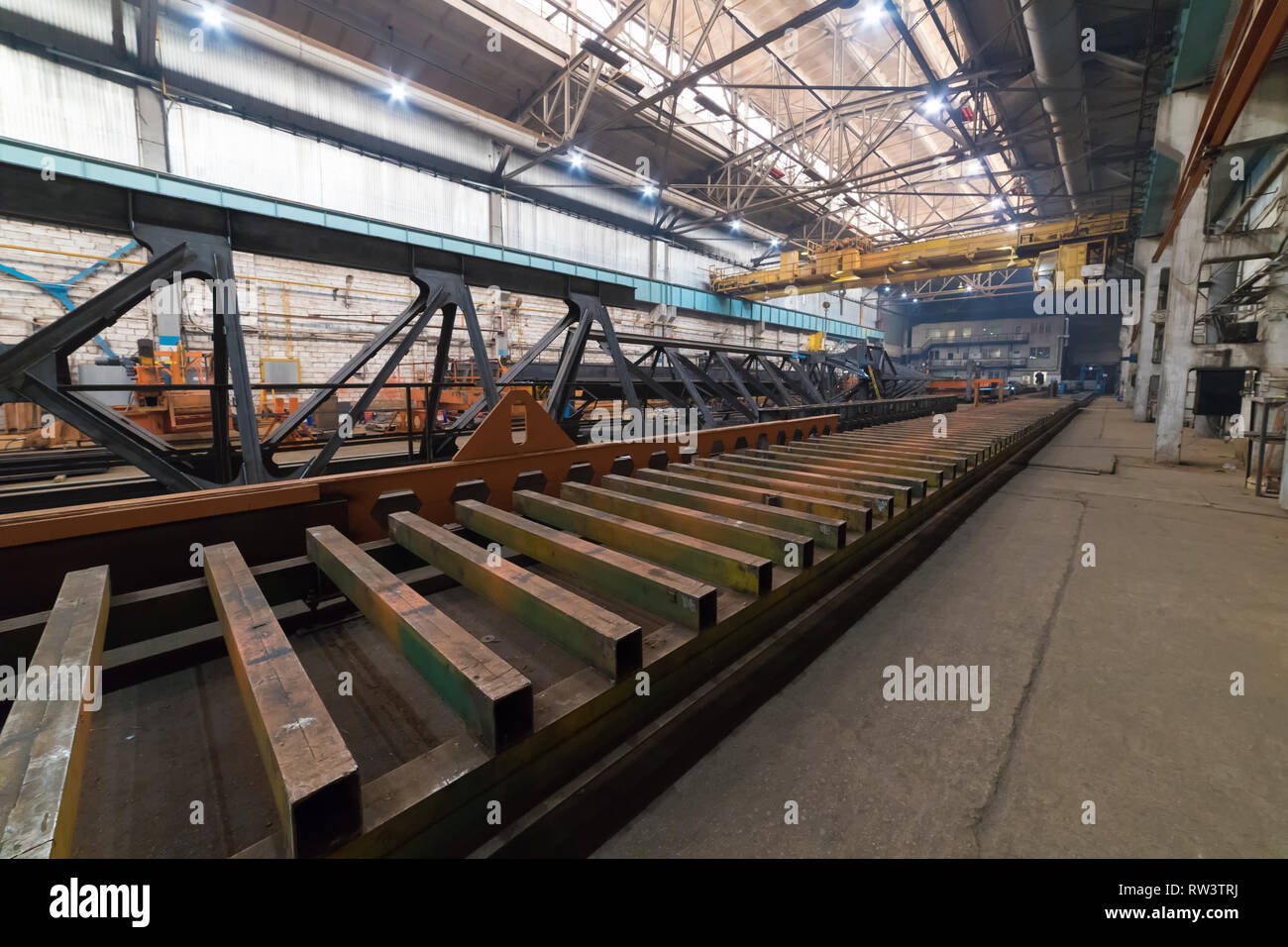 Industrial concept. An industrial metal beams rails Stock Photo - Alamy