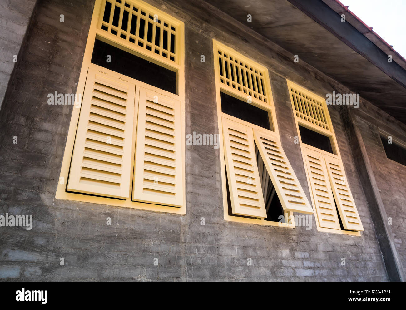 The vintage windows on rough brick wall, under construction Stock Photo ...