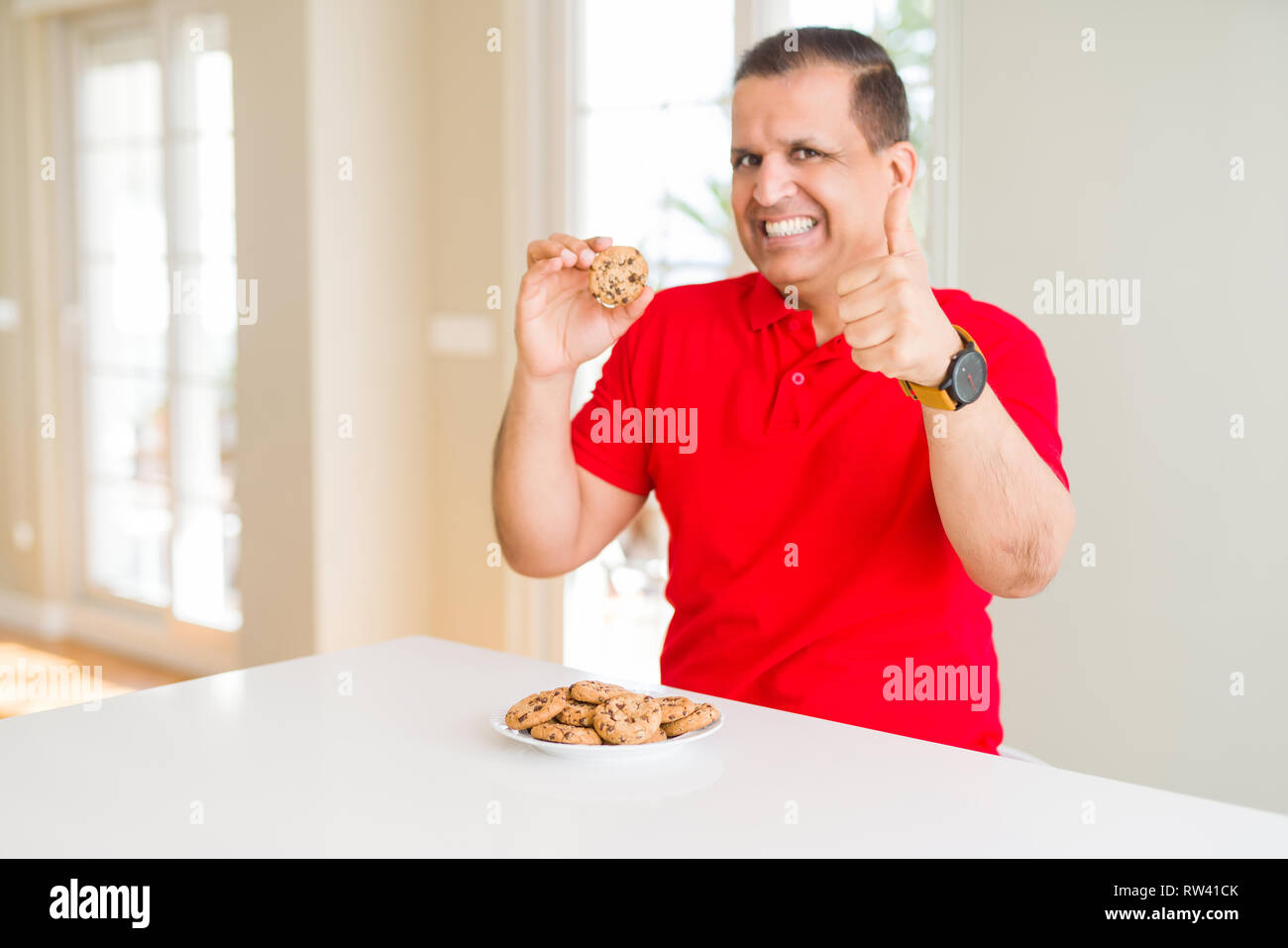 Old senior man eating chocolate hi-res stock photography and images - Alamy