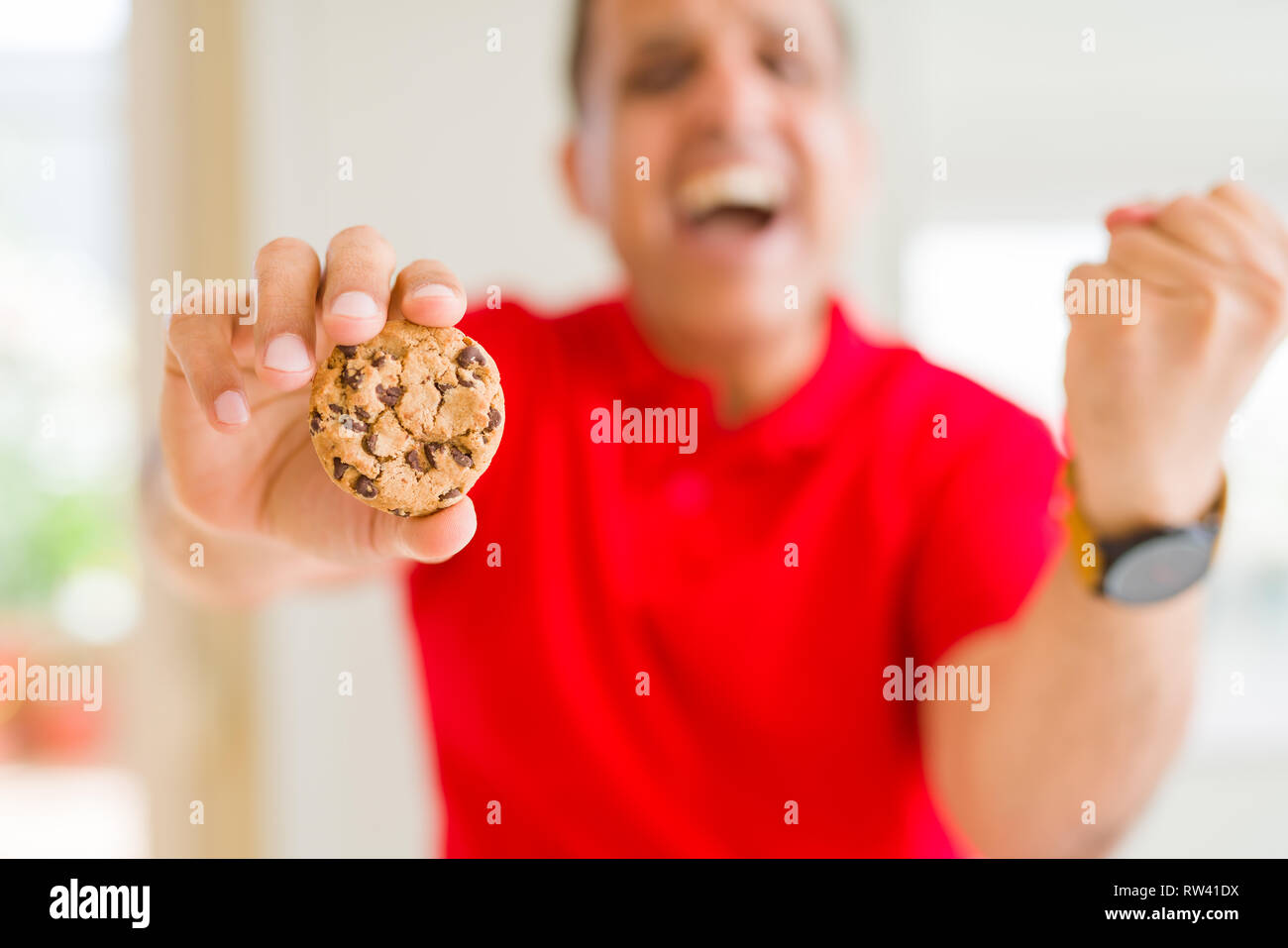 Old senior man eating chocolate hi-res stock photography and images - Alamy