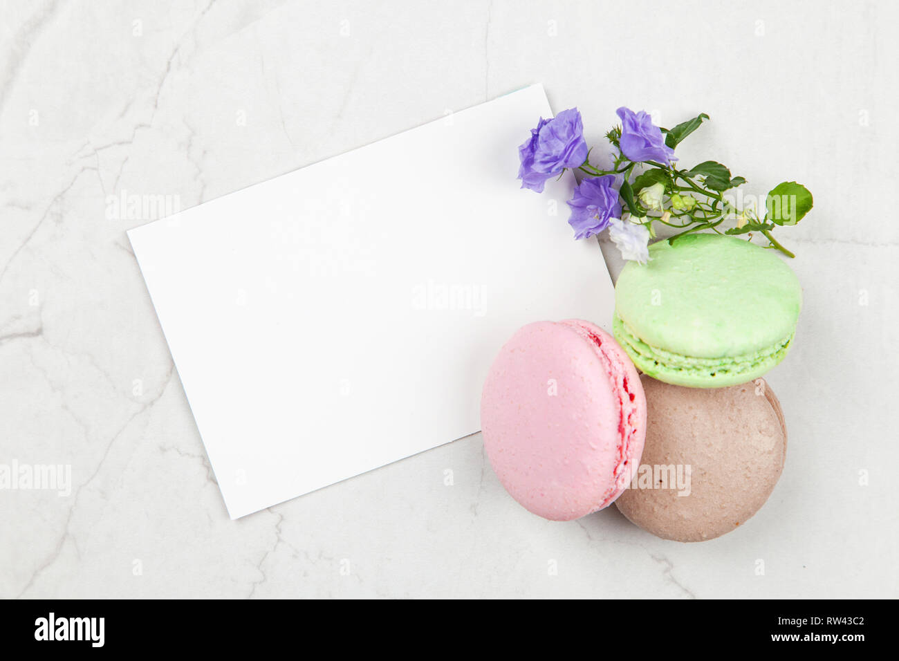Writing a postcard on white marble table Stock Photo - Alamy