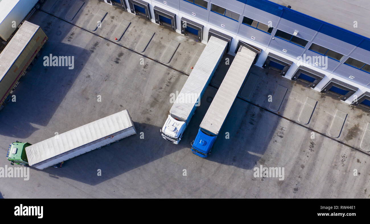 Aerial view, logistic warehouse, trucks ride near warehouse ramp Stock ...