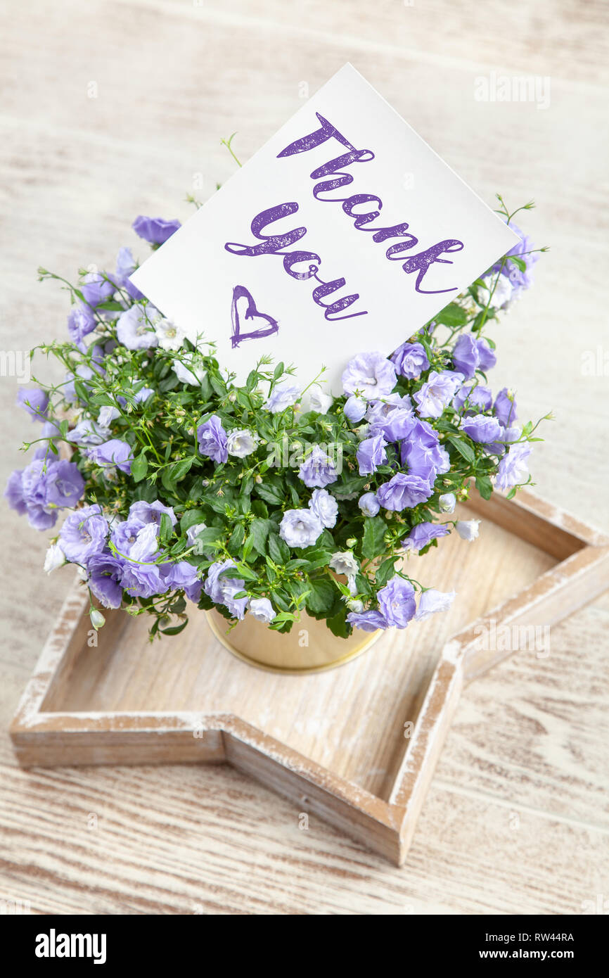 Thank You note on white marble table Stock Photo - Alamy