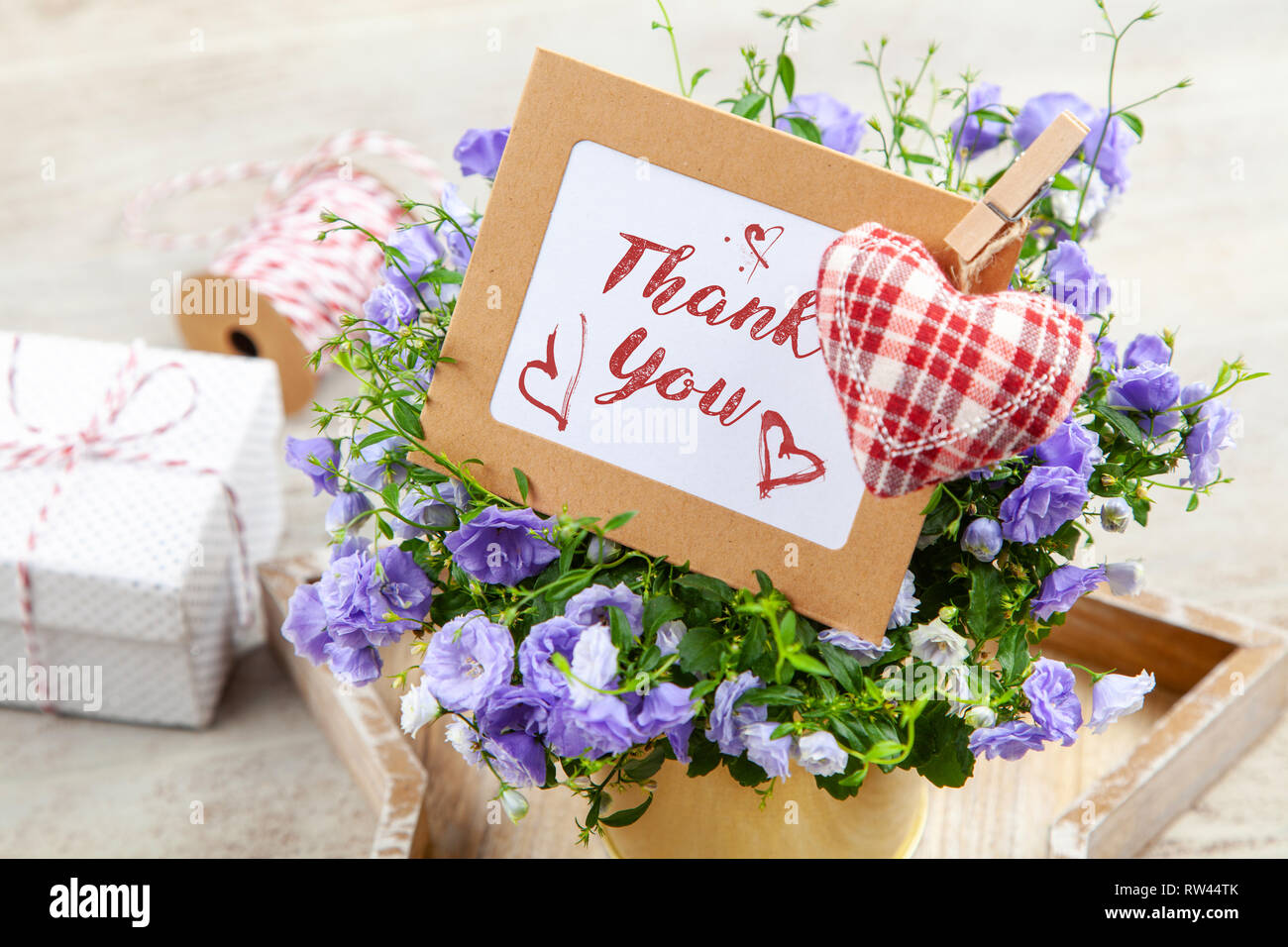 Thank You note on white marble table Stock Photo - Alamy